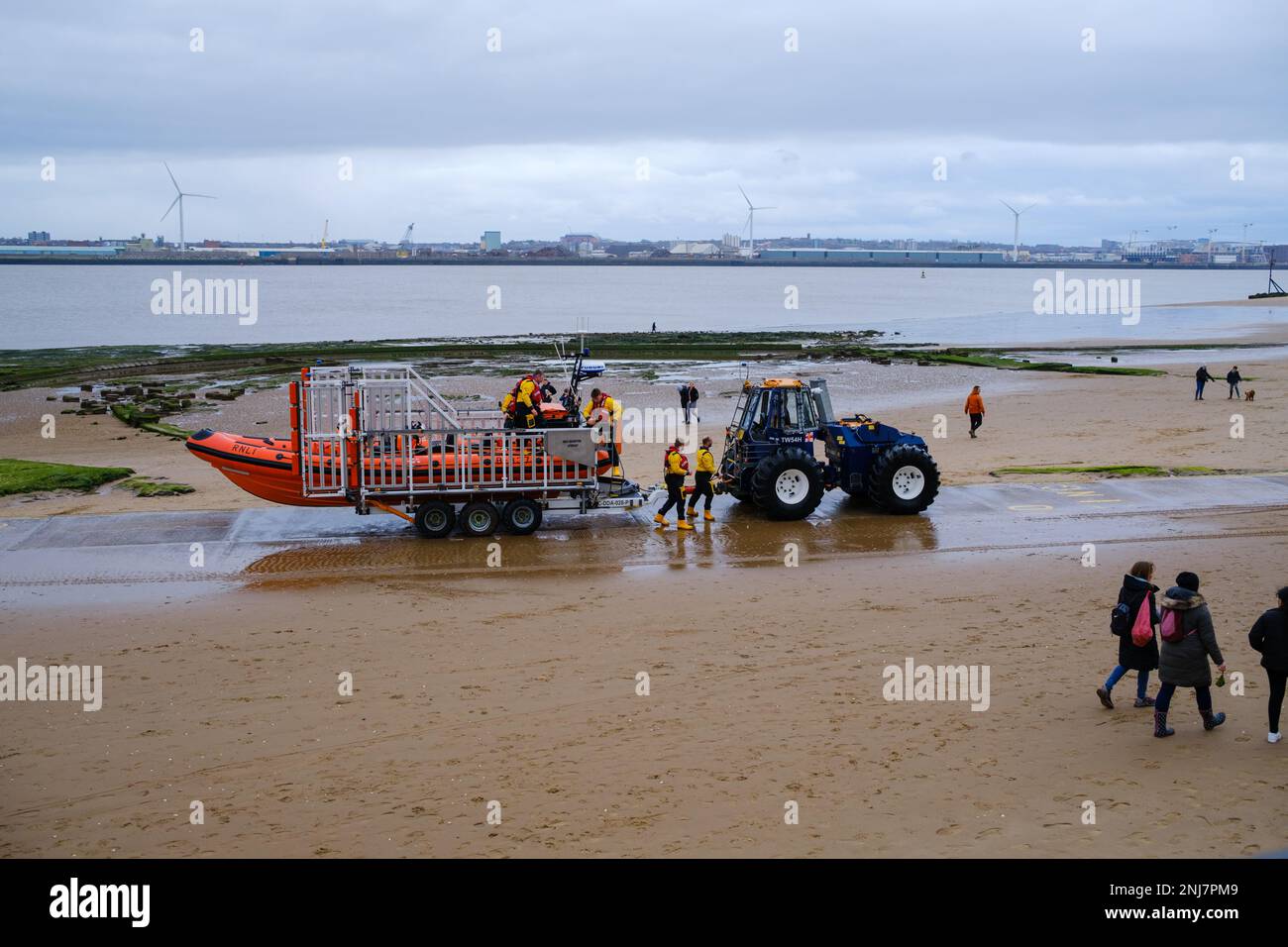 New Brighton life boat crew recovering the boat back up the beach with ...