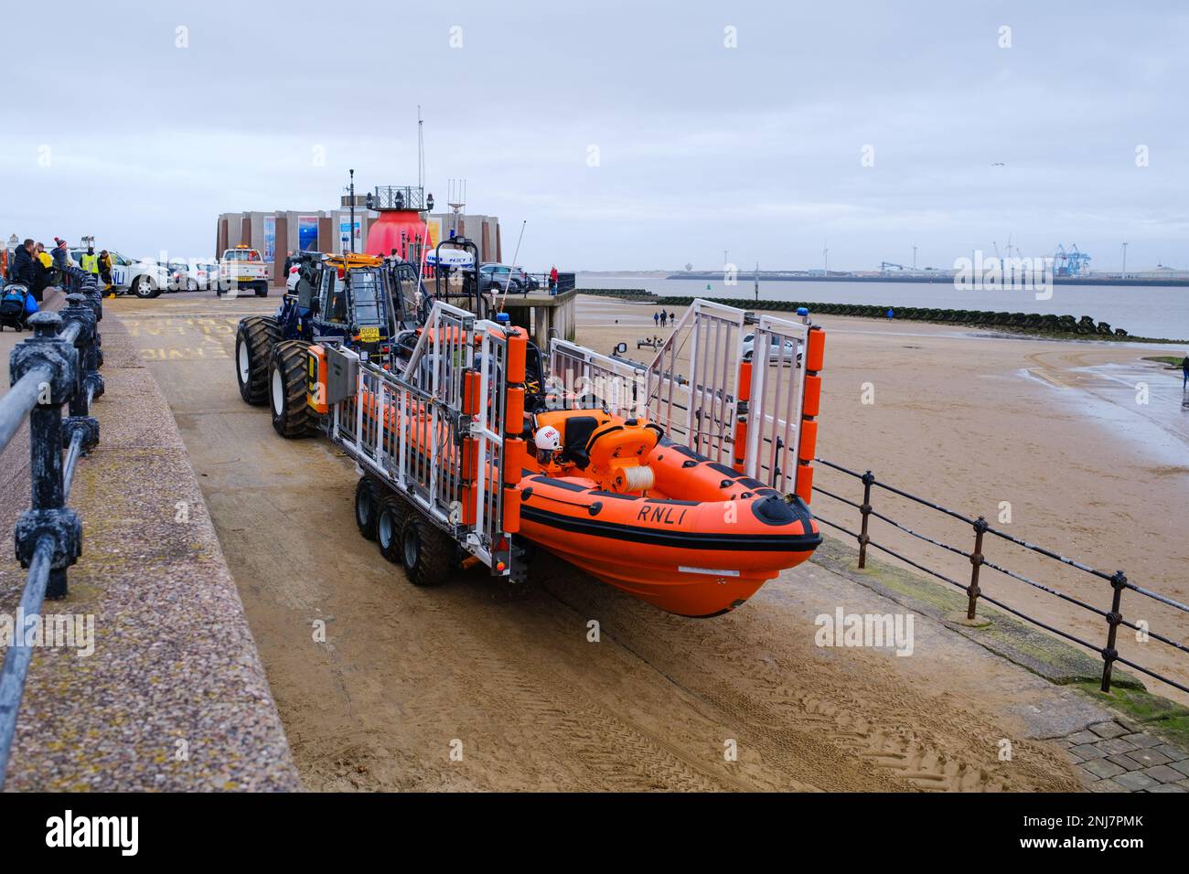 New Brighton life boat crew recovering the boat back up the beach with ...