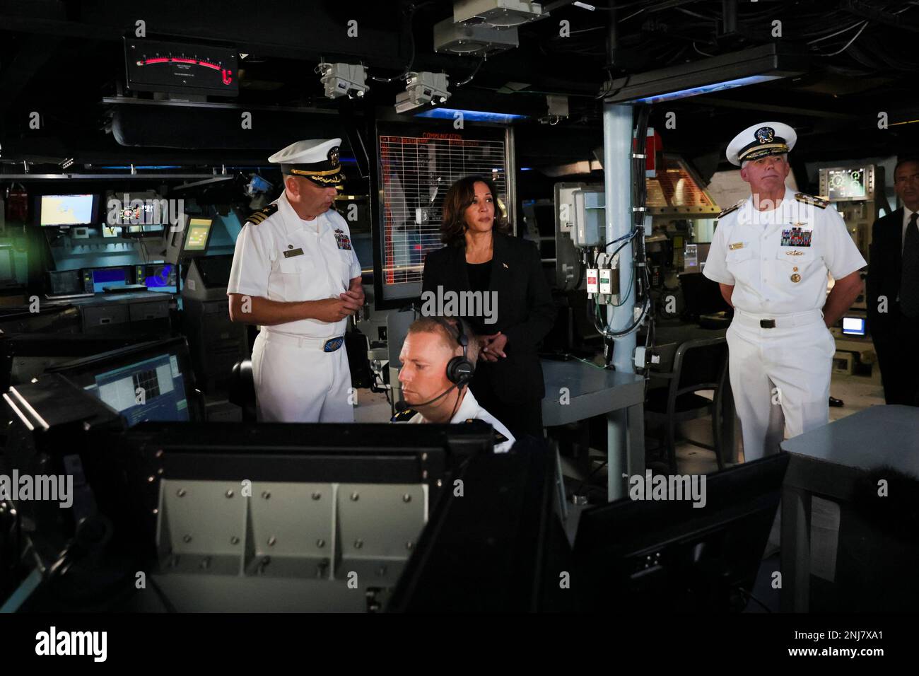 U.S. Vice President Kamala Harris, center, receives a briefing from ...