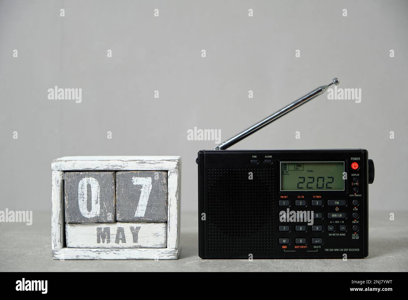 May 07, wooden calendar and radio gray background.Concept for Radio day ...