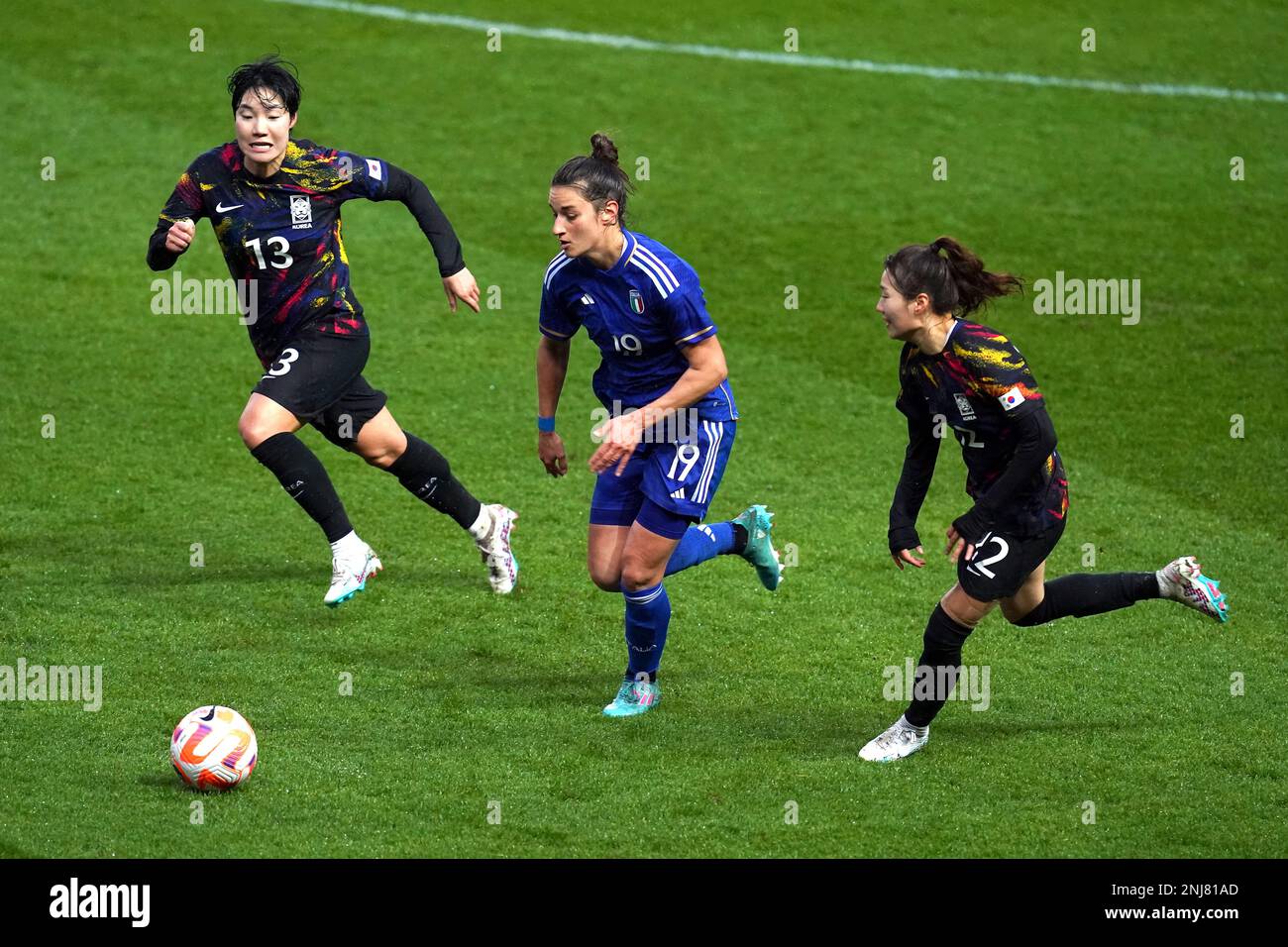 Italy's Martina Lenzini (centre) battles for the ball with South Korea ...