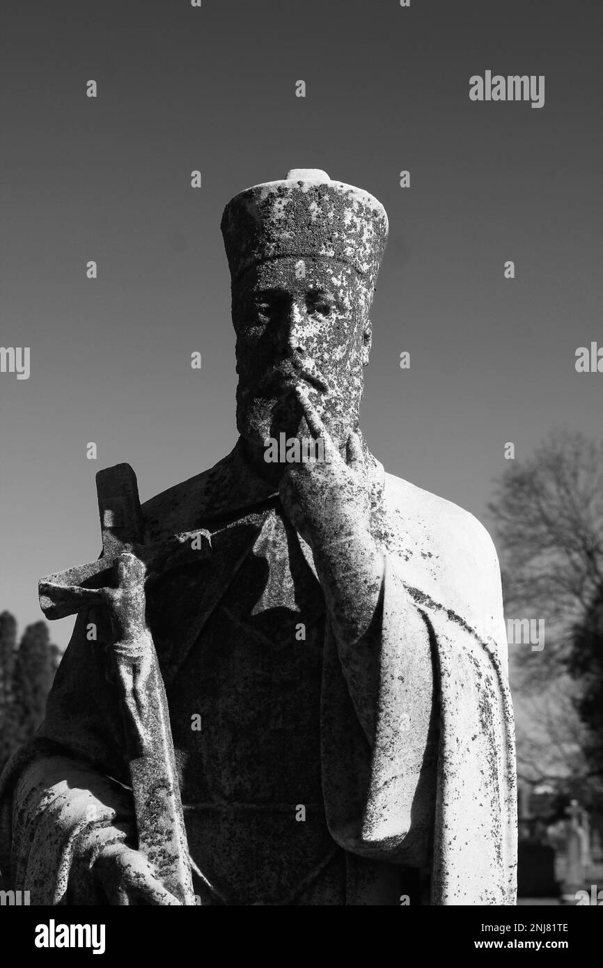 A natural stone statue of a high ranking bishop of the Christian ...