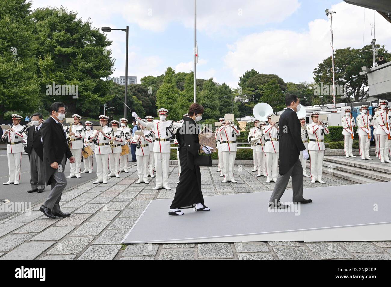 Akie Abe, center, wife of former Prime Minister Shinzo Abe, follows Prime Minister Fumio Kishida ...