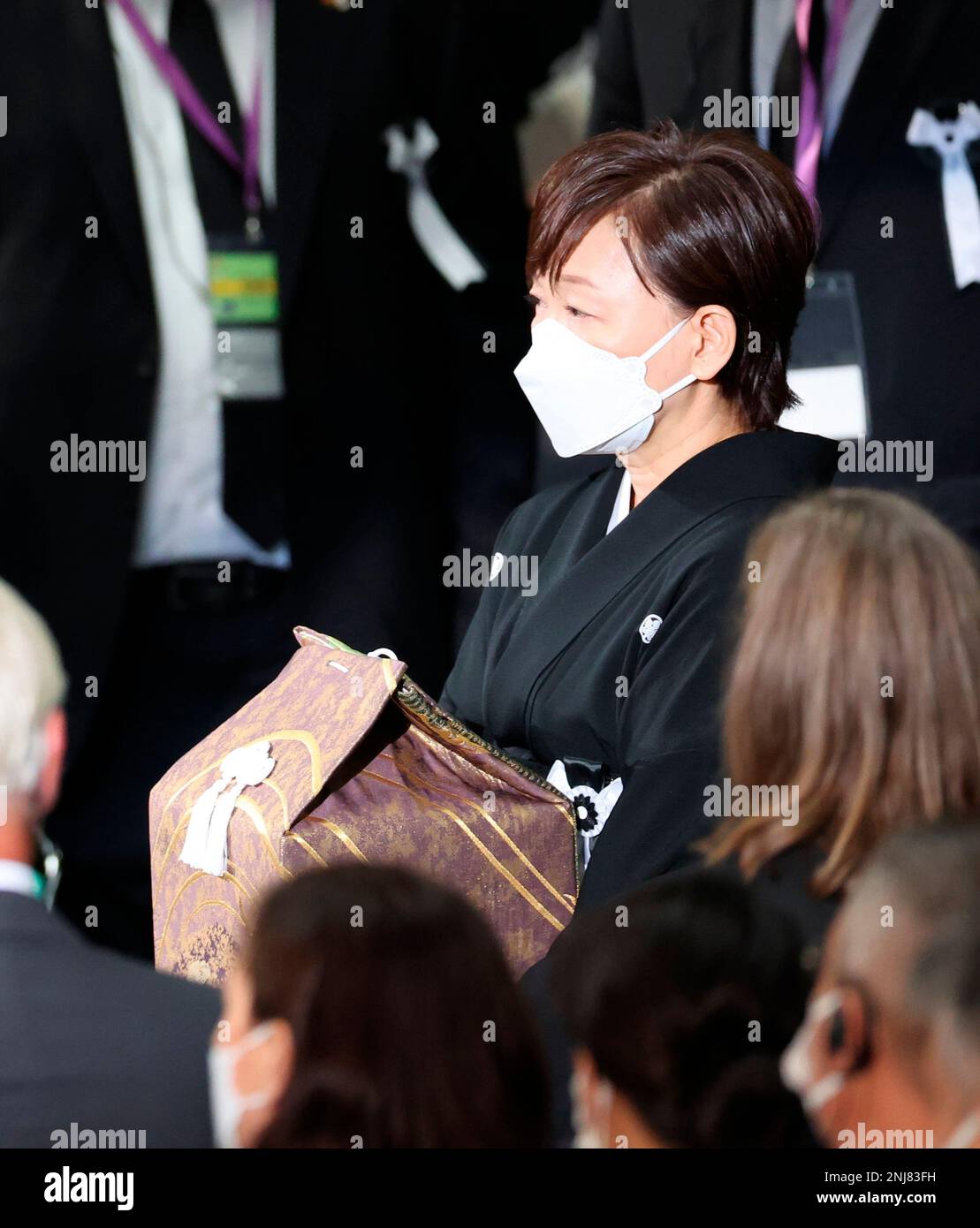 Akie Abe, former Prime Minister Shinzo Abe's wife, holding his urn ...