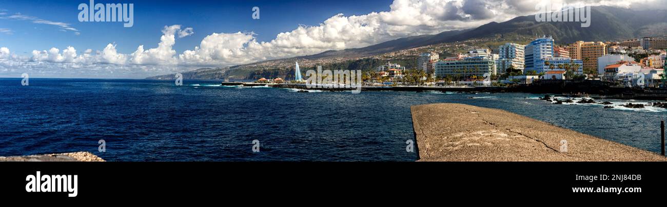 Warm sunshine palliative view from Puerto de la Cruz harbour across the ...