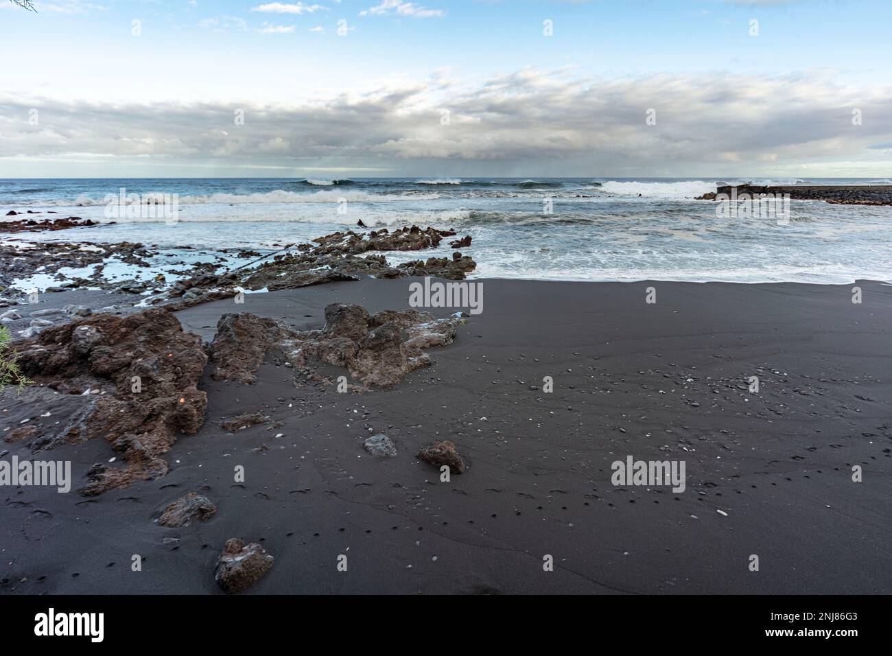 Stunning black sand beach landscape at Playa Jardin Puerto de la Cruz ...