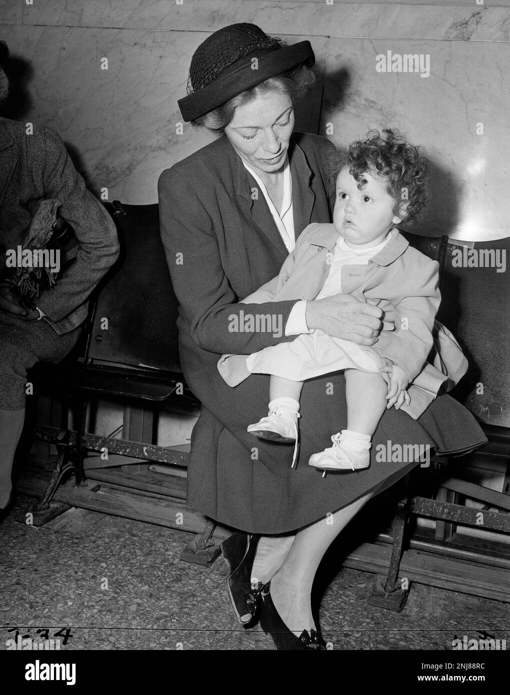 Carol Ann Berry, 14-month-old daughter of Joan Berry, sits on the lap ...