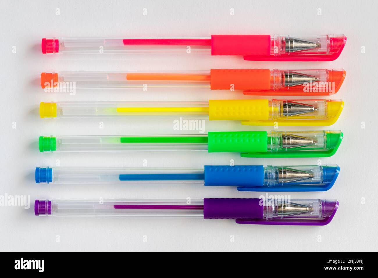 Colorful set of neon rainbow colors gel pens on white background Stock ...