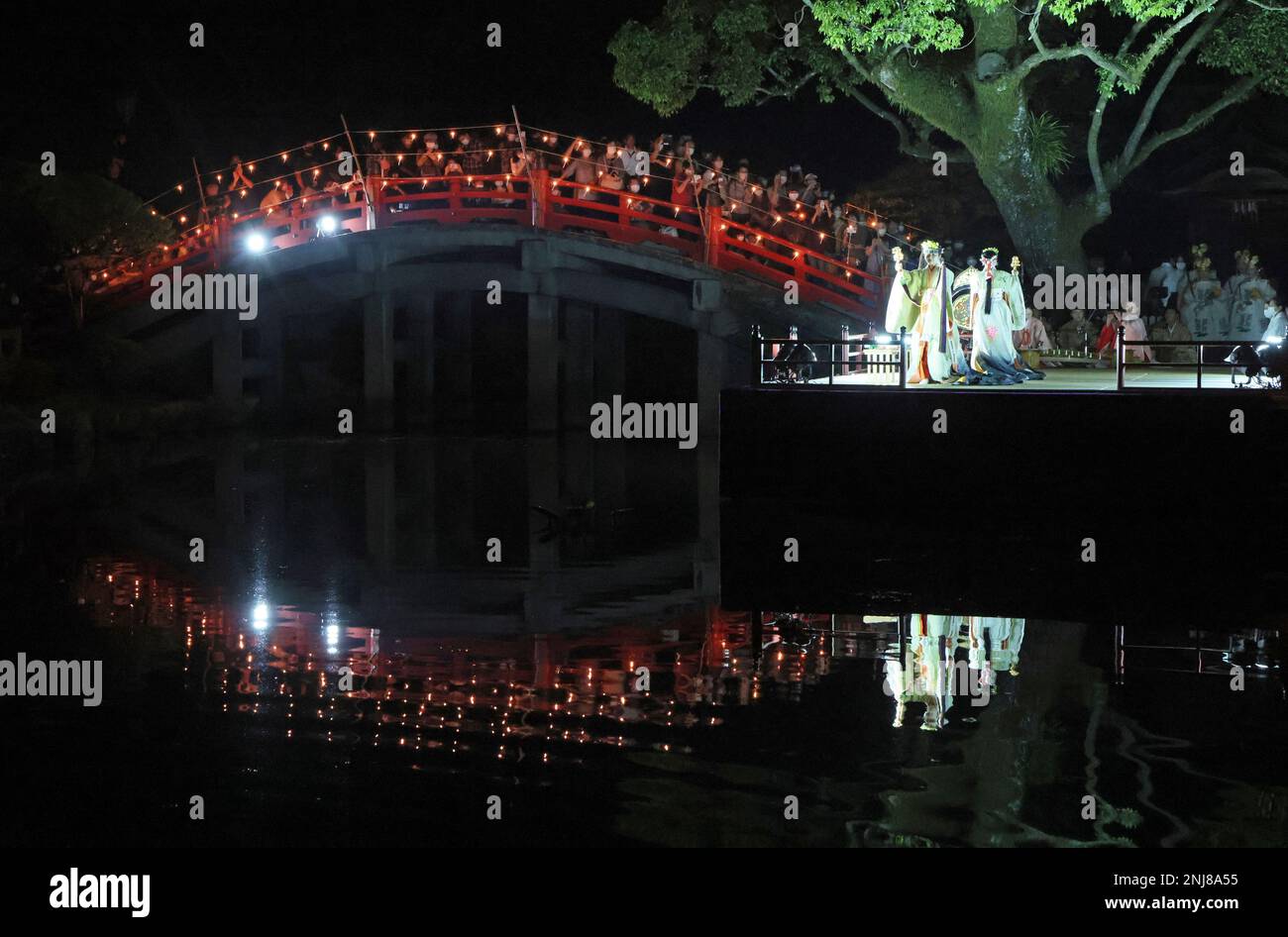 Kagura is performed near the pond on the compound at Dazaifu Tenmangu ...