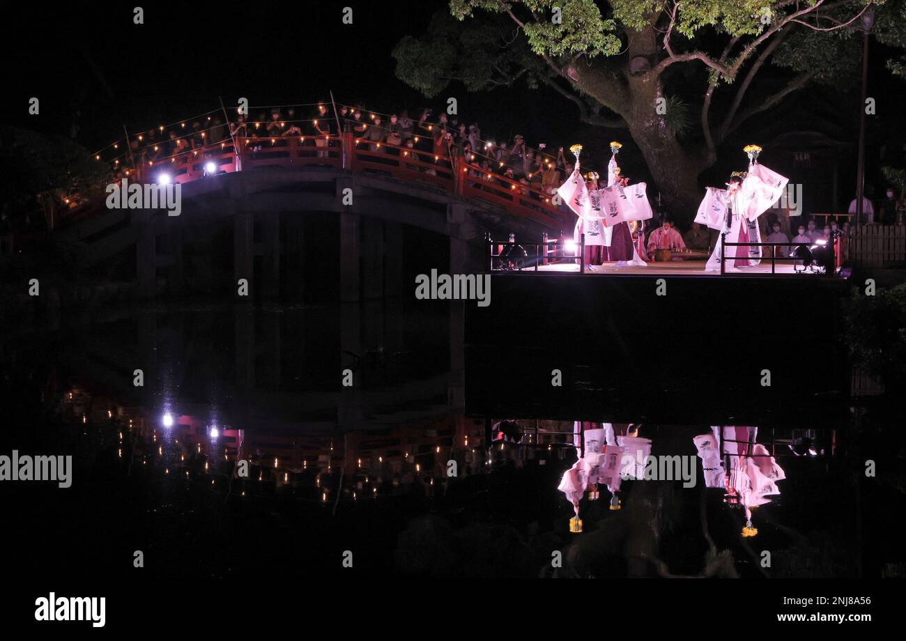Kagura is performed near the pond on the compound at Dazaifu Tenmangu ...
