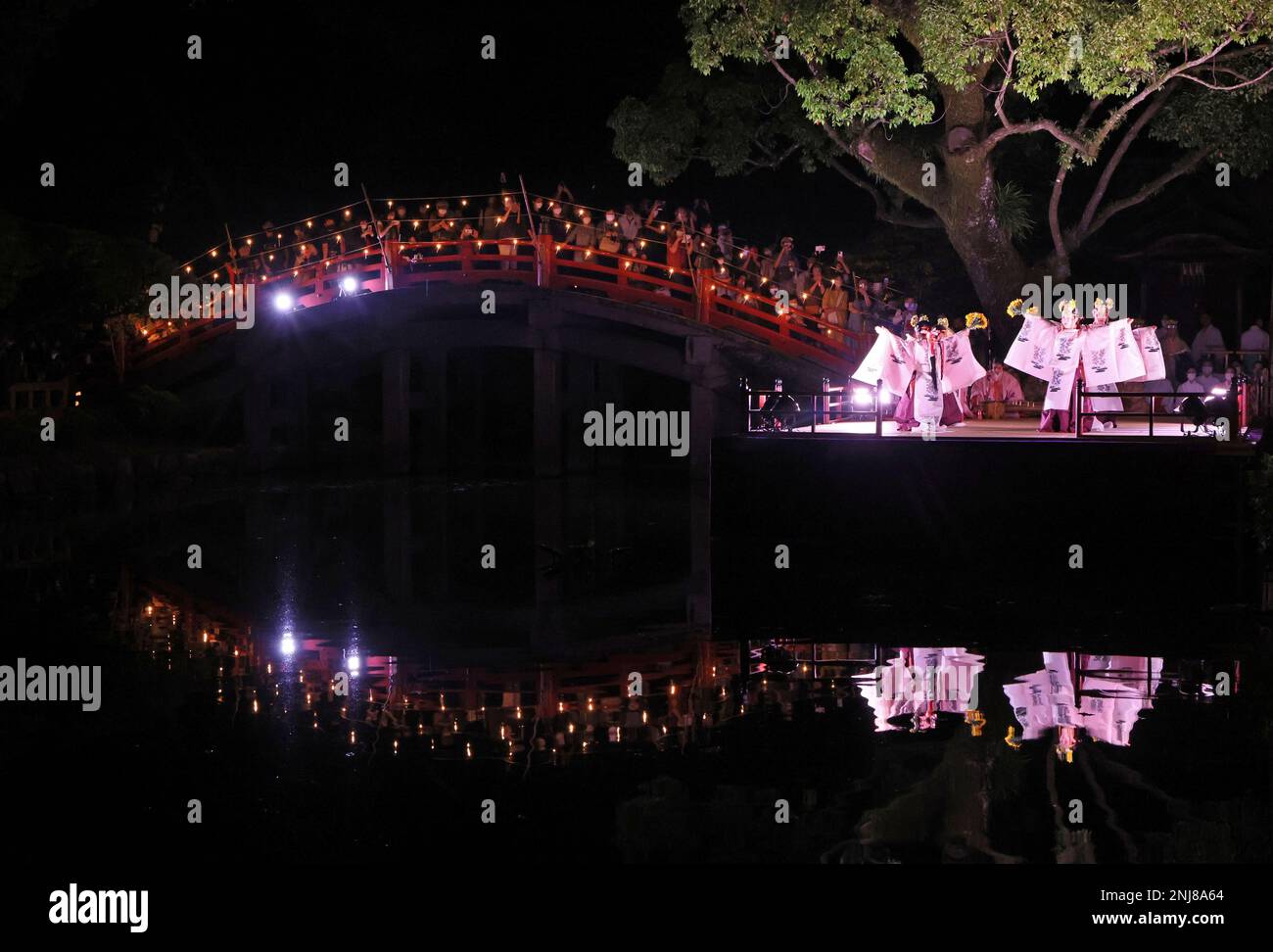 Kagura is performed near the pond on the compound at Dazaifu Tenmangu ...