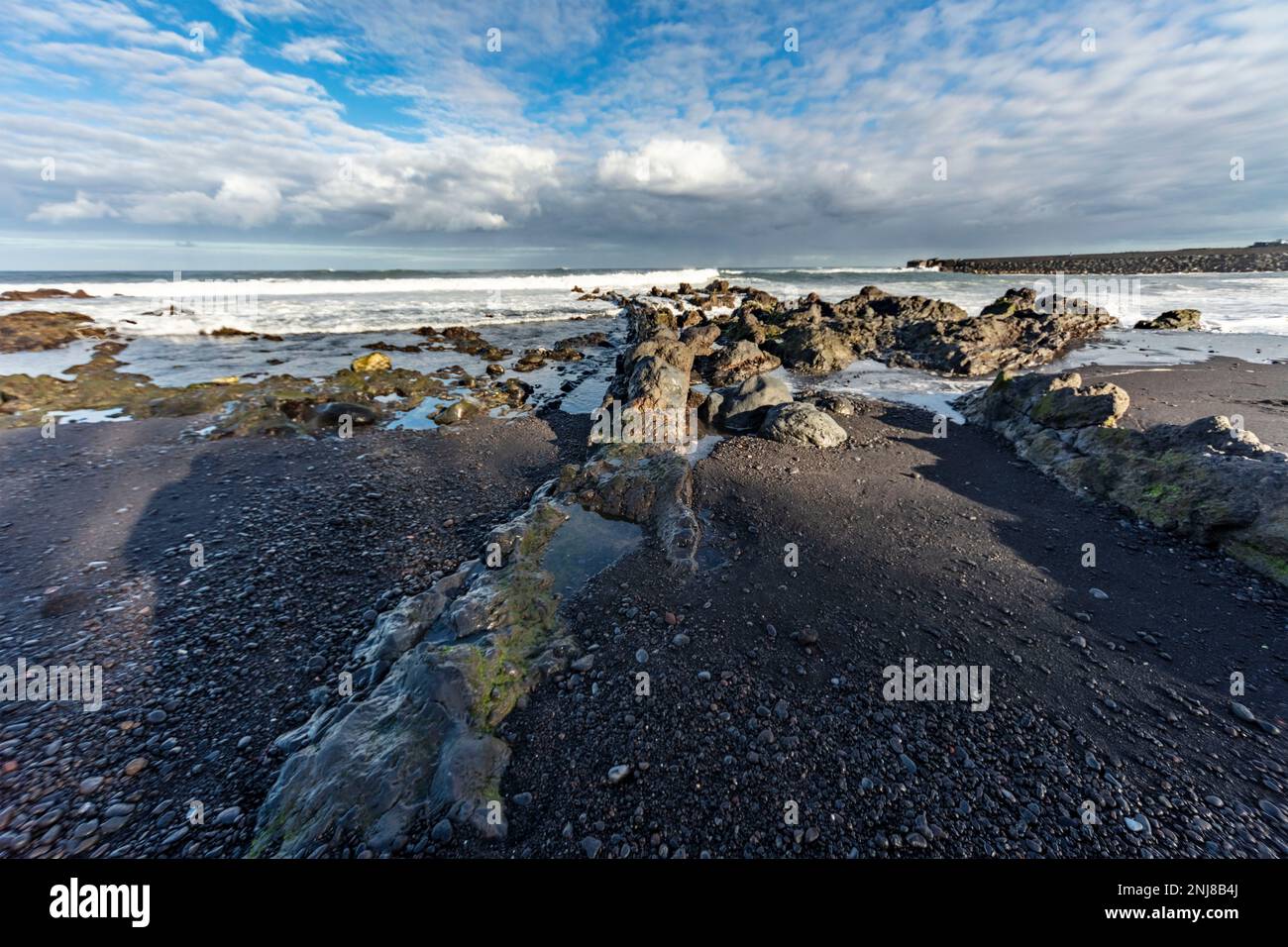 Stunning black sand beach landscape at Playa Jardin Puerto de la Cruz ...