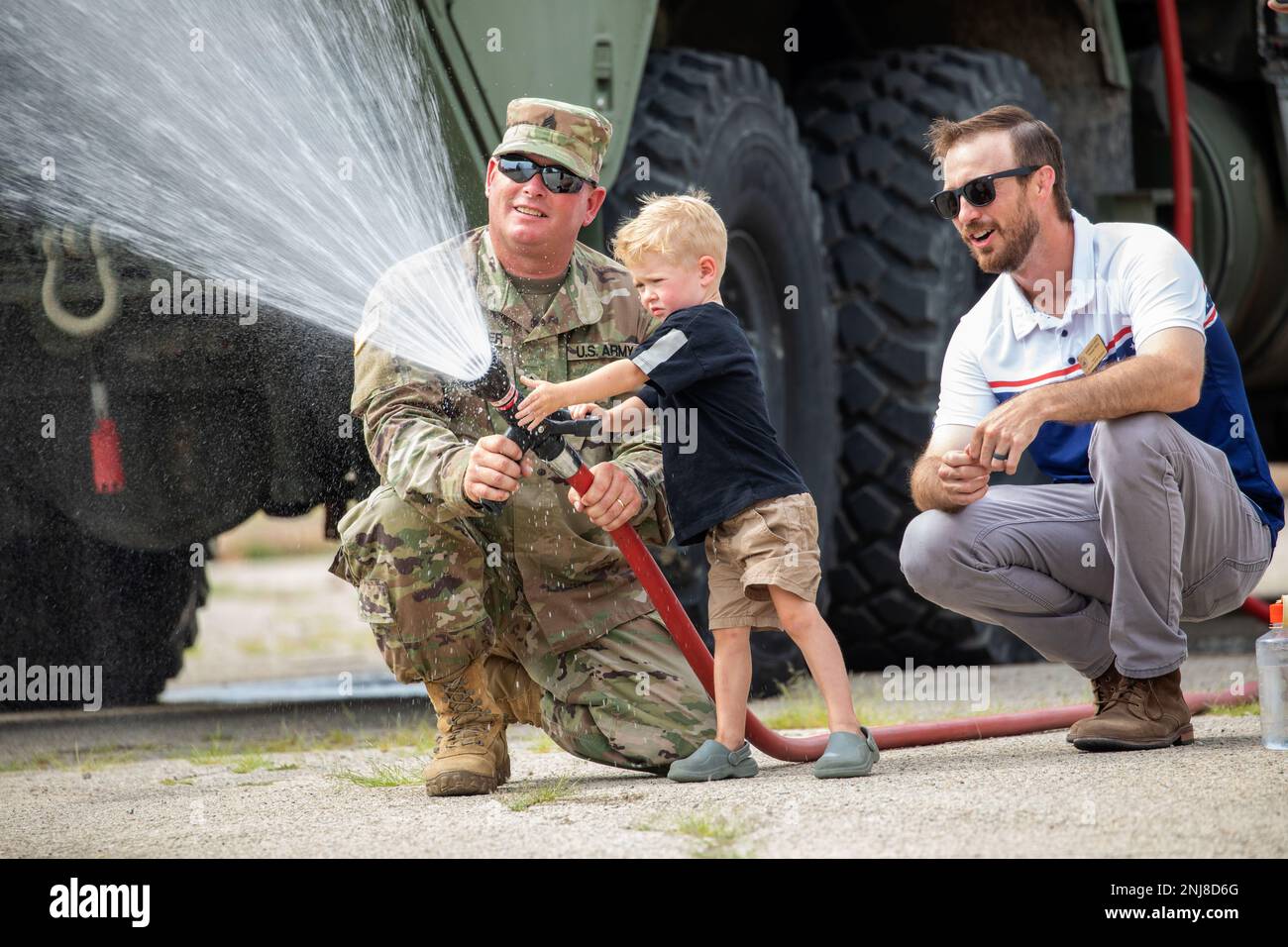 Sgt. Steve Krueger, 467th Engineer Battalion, helps Israel Swift and ...