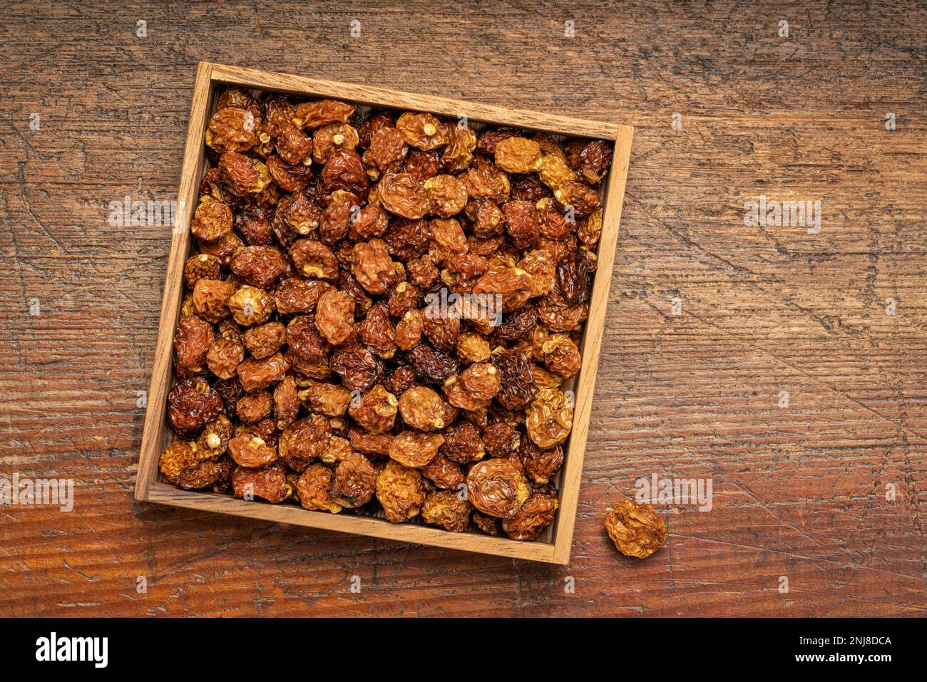 dried goldenberries in a square wooden box against rustic wood Stock ...