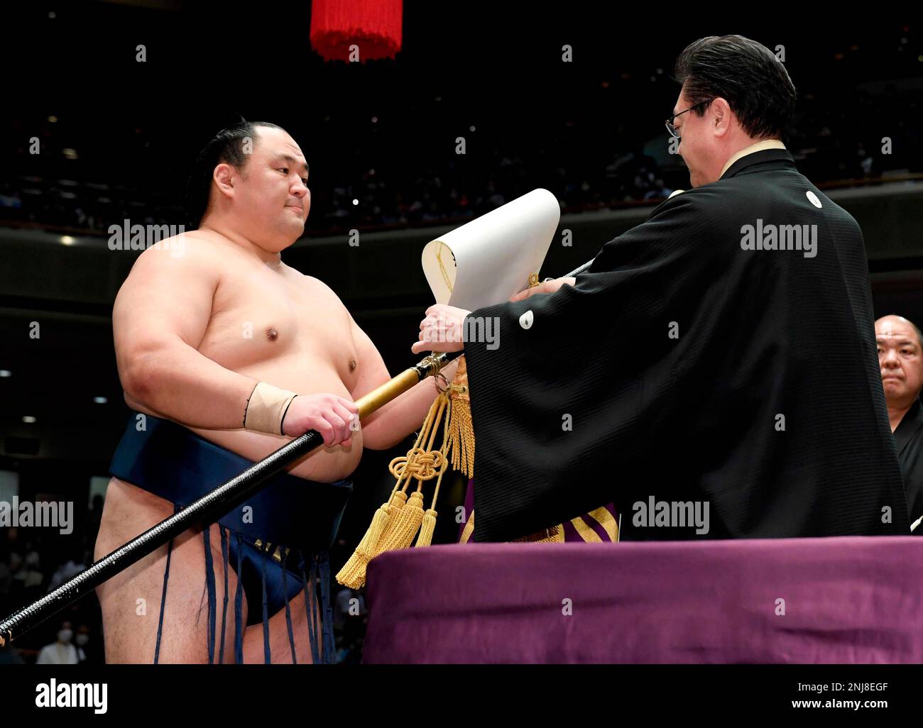 Tamawashi of Mongolia (maegashira #3) receives a championship flag ...