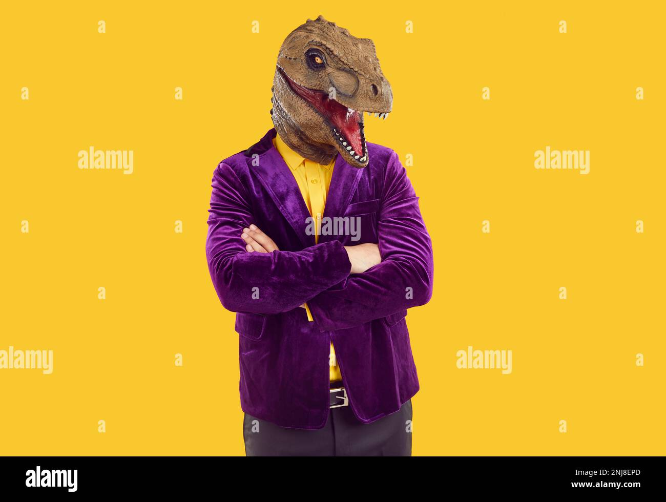 Portrait of funny extravagant man in dinosaur mask who confidently ...