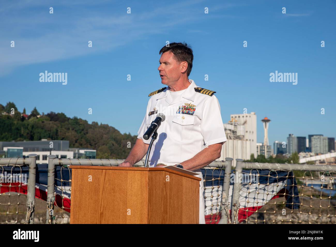 Capt. Steve Foley, commanding officer, USS Lake Champlain, speaks ...