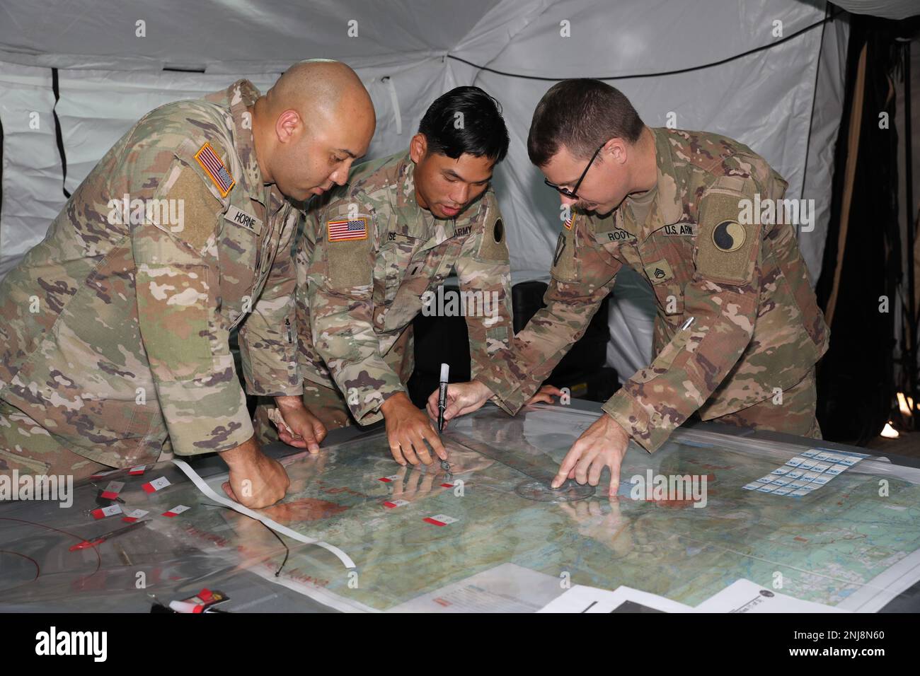 Spc. Cary Horne, an intelligence specialist, left, 1st Lt. Kevin Tse, a ...