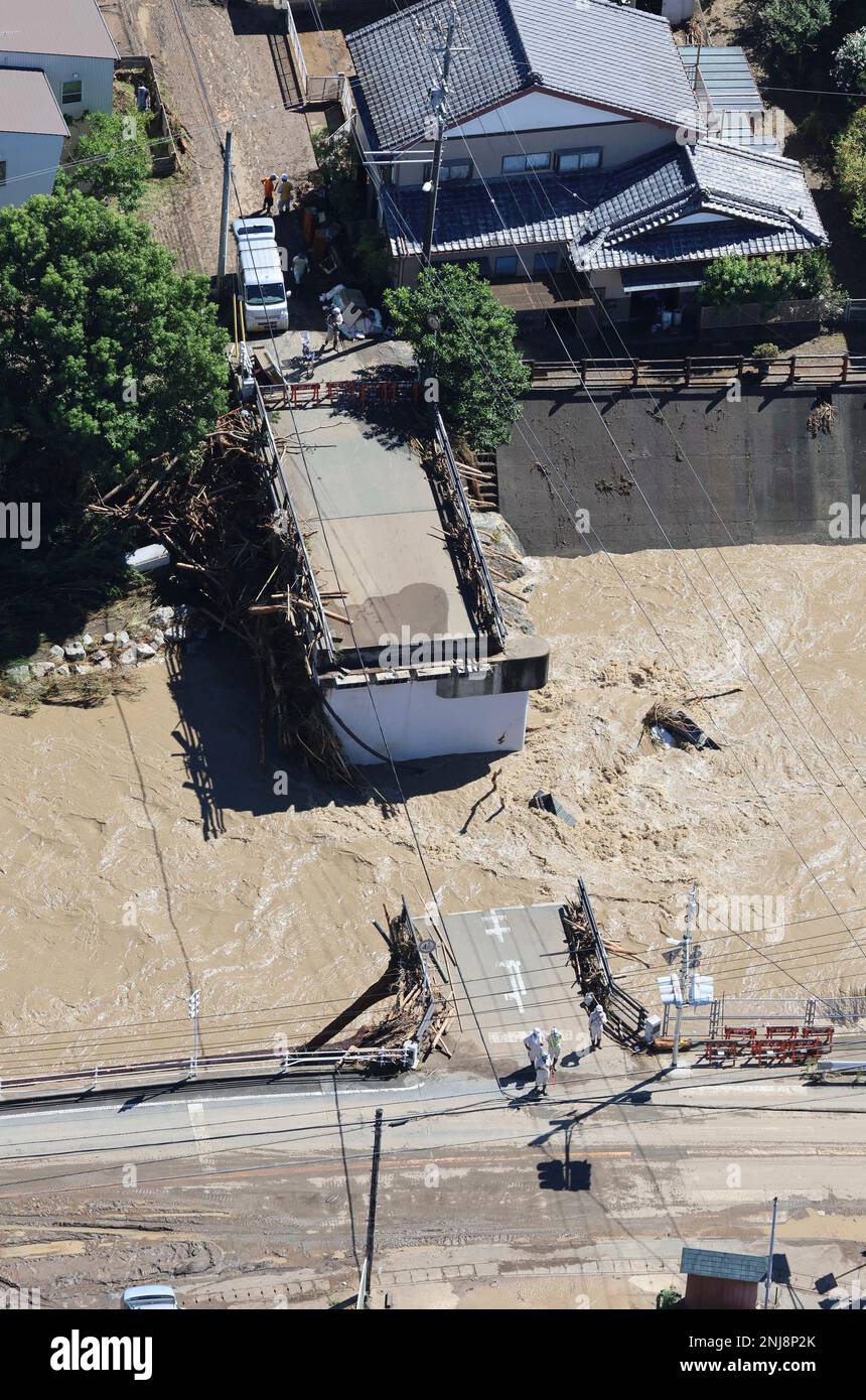 An aerial photo shows a collapsed bridge triggered by heavy rain of ...