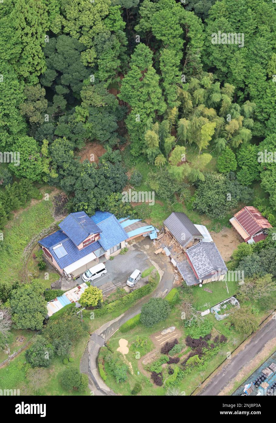 An aerial photo shows a collapsed house triggered by heavy rain of ...
