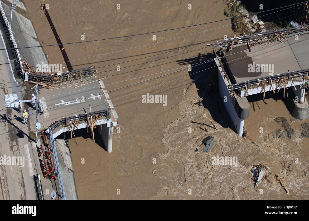 An aerial photo shows a collapsed bridge triggered by heavy rain of ...