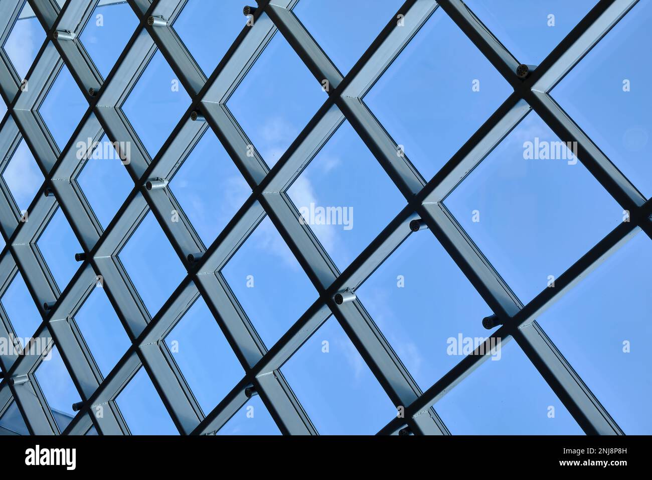 Below view of glass roof consisting of square and triangle segments ...