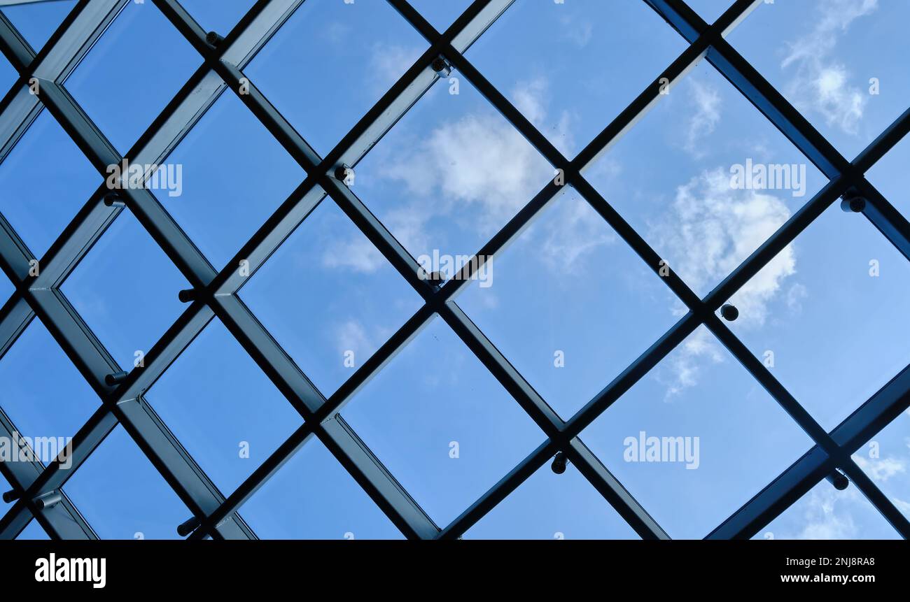 Below view of glass roof consisting of square and triangle segments ...