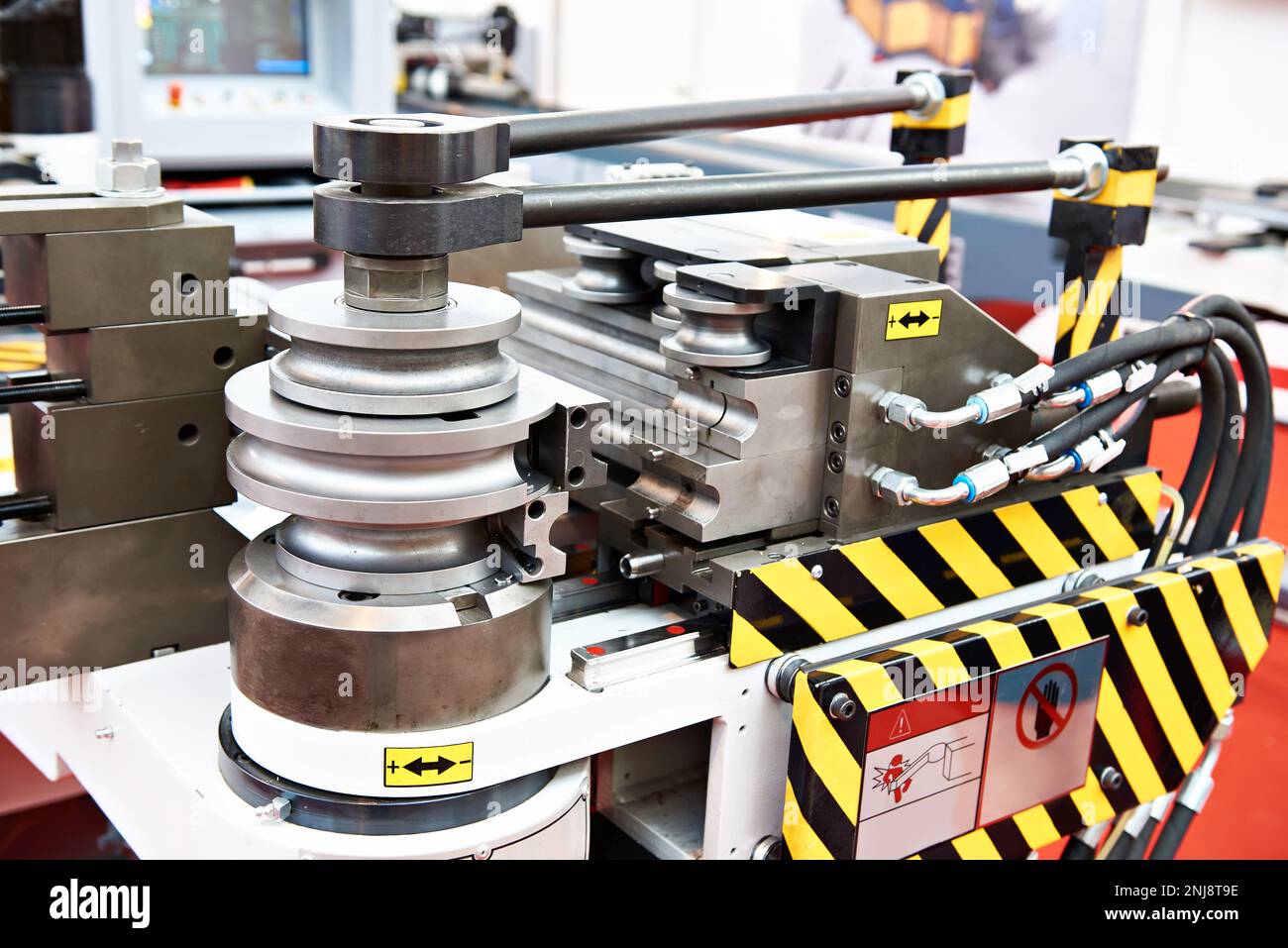 Machine for bending metal rods and pipes Stock Photo - Alamy