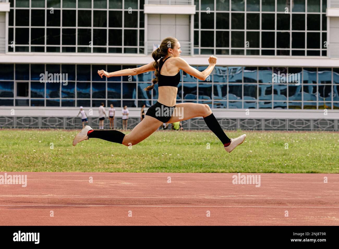 Female triple jump hi-res stock photography and images - Alamy