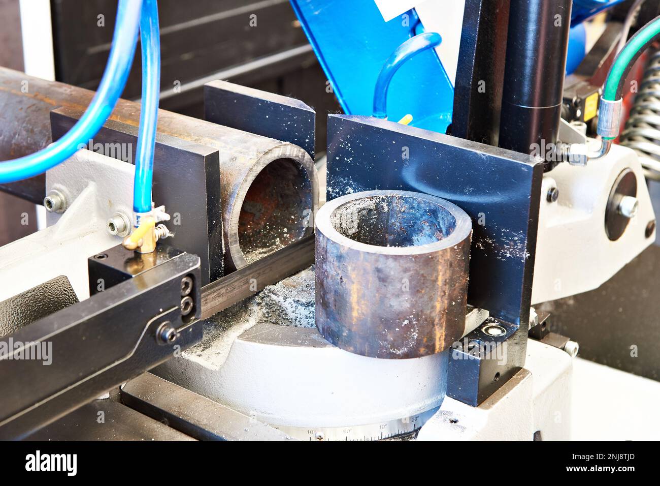 Automatic band saw with a steel workpiece Stock Photo - Alamy