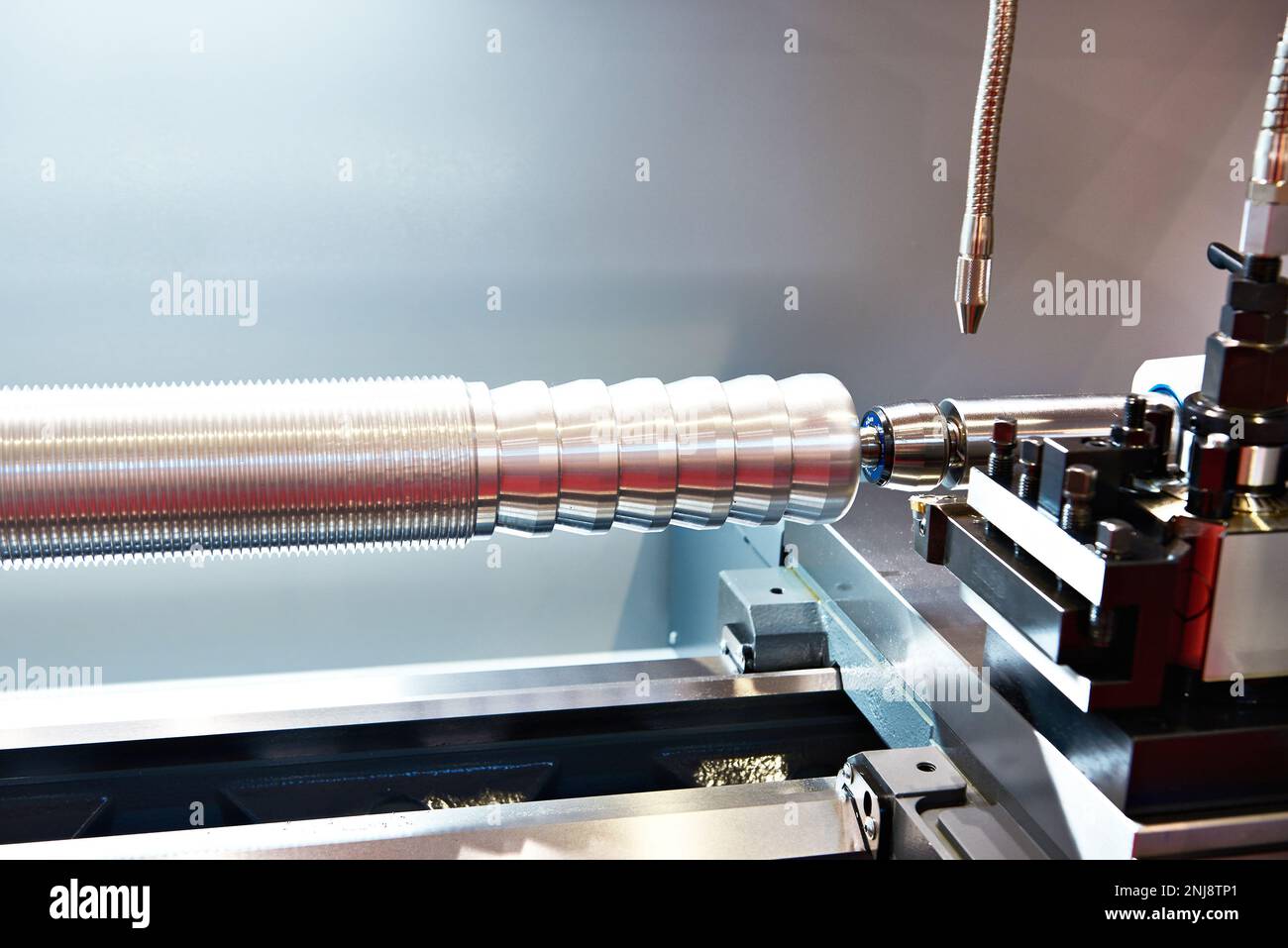 Steel product in the lathe Stock Photo - Alamy
