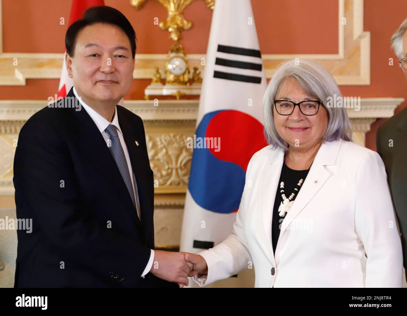 South Korean President Yoon Suk Yeol shakes hands with Gov. Gen. Mary ...