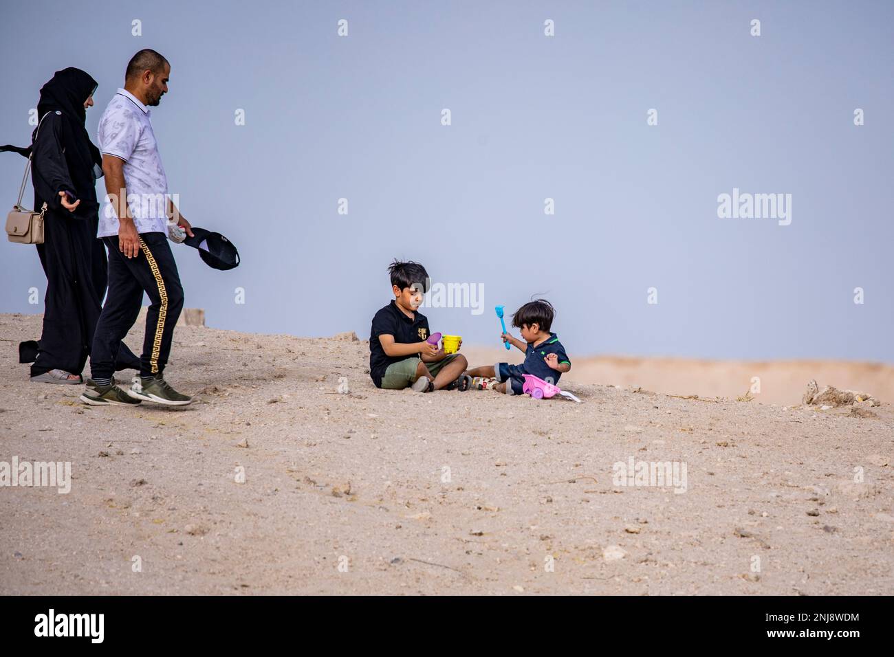 Children play whit sand in the desert in Bahrain Stock Photo - Alamy