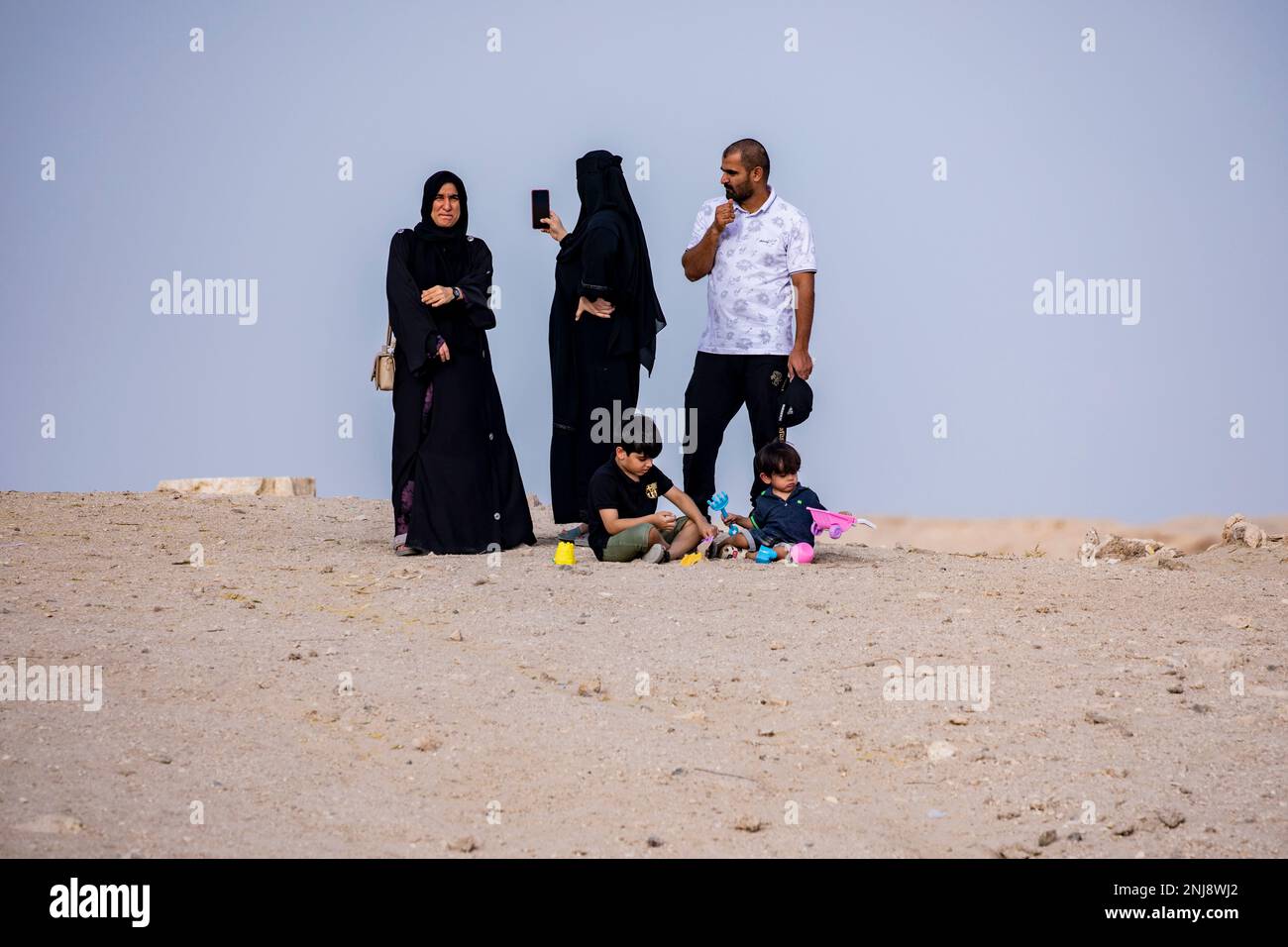 Children play whit sand in the desert in Bahrain Stock Photo - Alamy