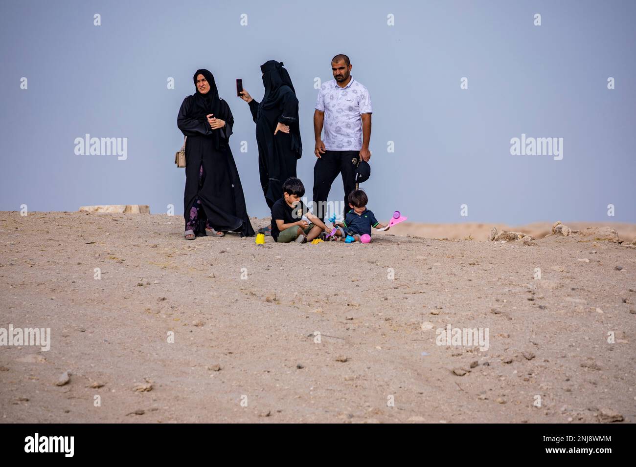 Children play whit sand in the desert in Bahrain Stock Photo - Alamy