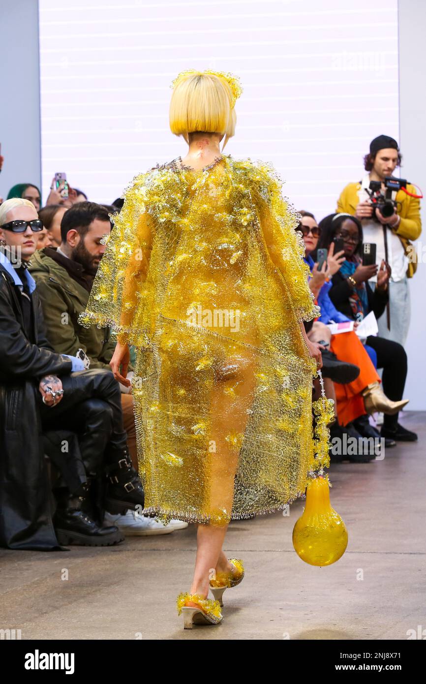 London, UK. 19th Feb, 2023. A model walks the runway wearing an outfit ...