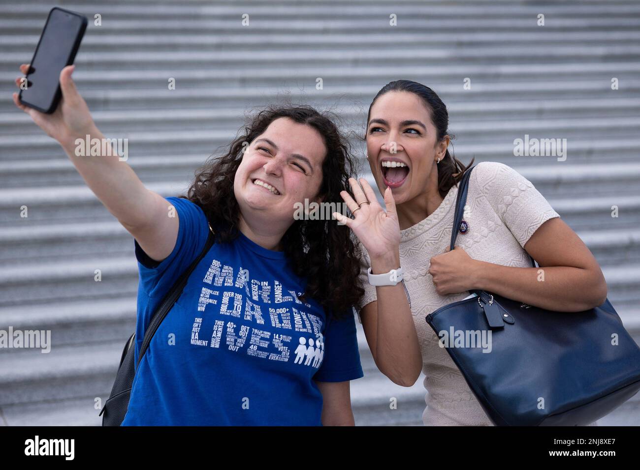 Rep. Alexandria Ocasio-Cortez (D-N.Y.) poses for a selfie with Sarah ...