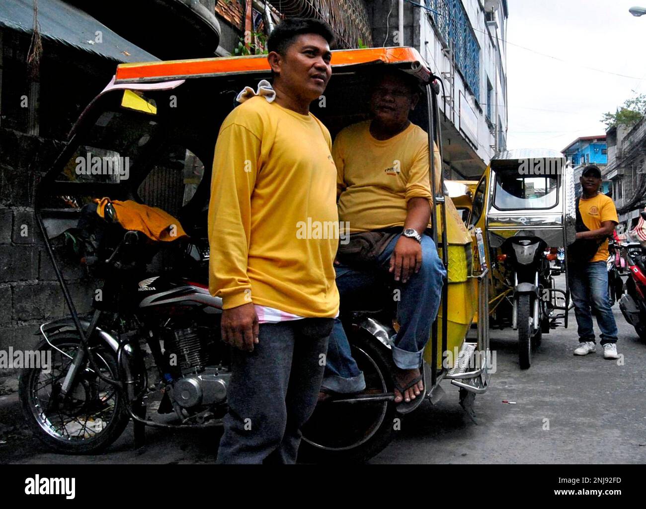 Drivers of tricycles, auto rickshaw, are pictured in Manila ...