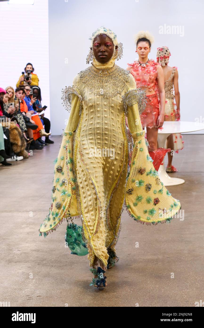 London, UK. 19th Feb, 2023. A model walks the runway wearing an outfit ...
