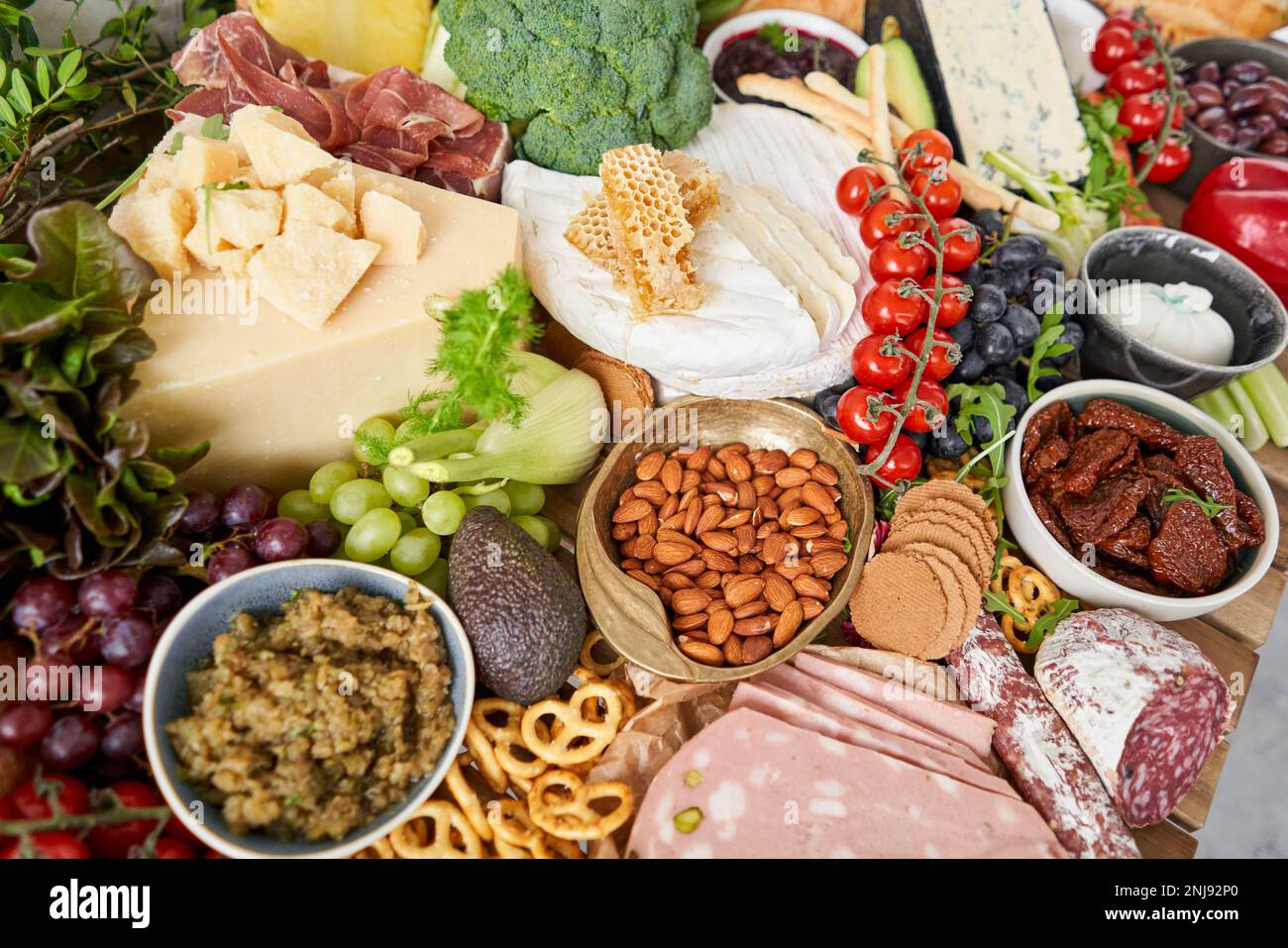 Table full of mediterranean appetizers, tapas or antipasto. Assorted ...