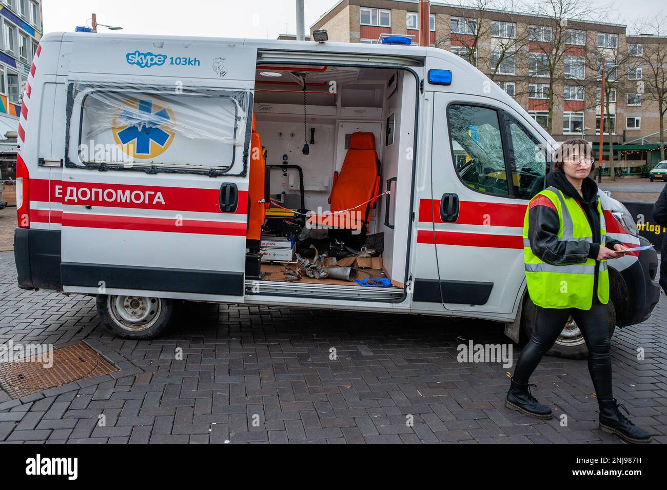 A Ukrainian volunteer is seen sharing flyers about the story of the ...