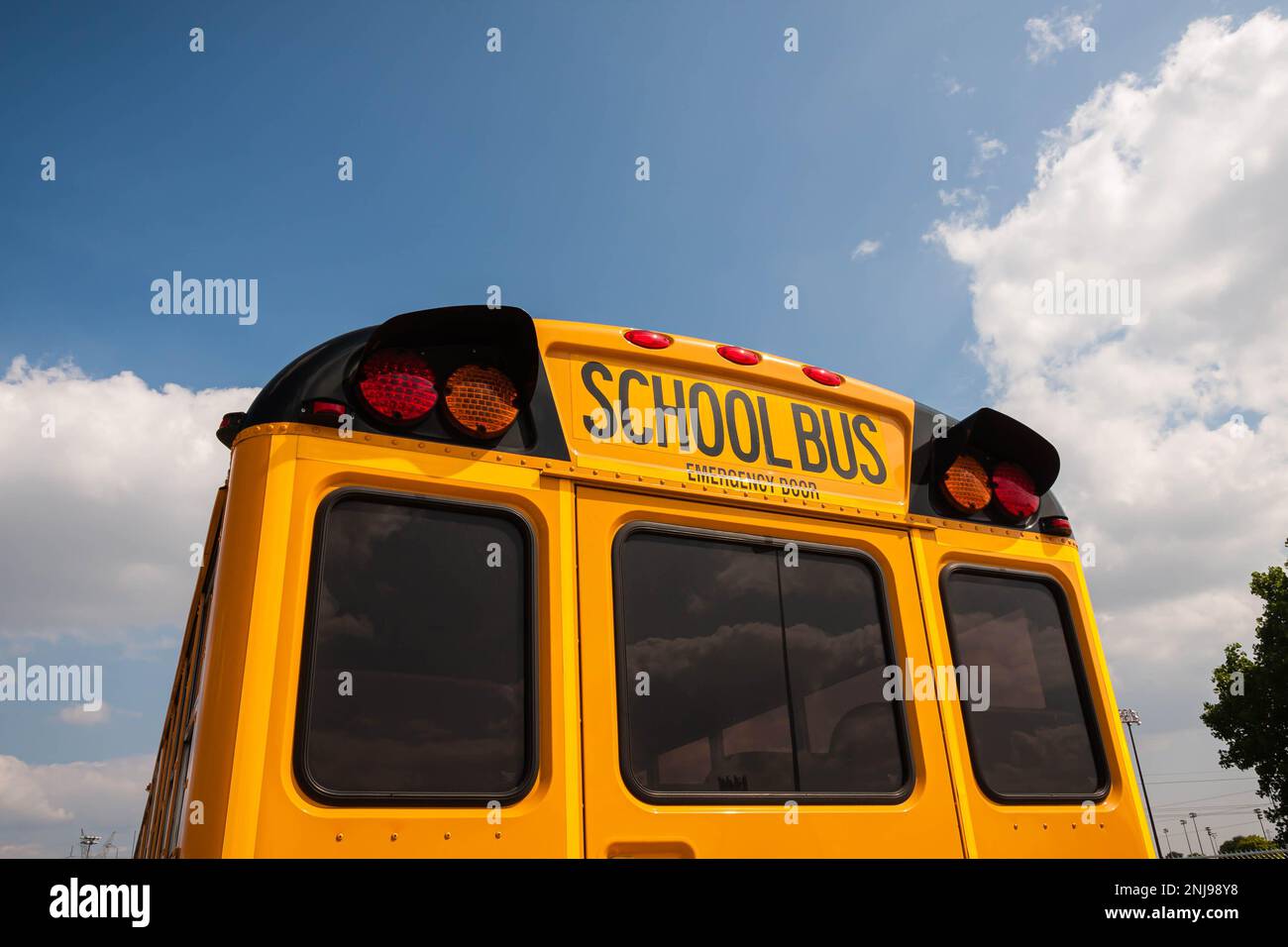 School Bus with blue sky Stock Photo - Alamy