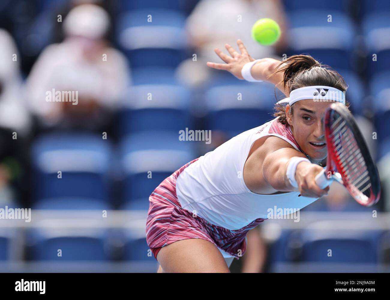 Caroline GARCIA of France hits a ball against Shuai ZHANG of China ...