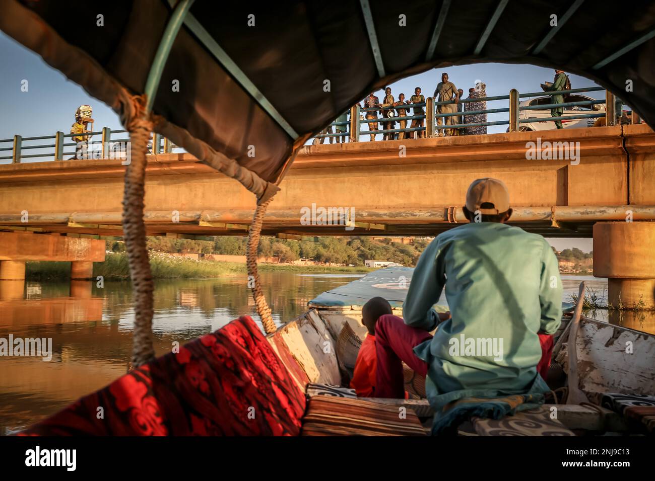 A man rows his boat along the Niger River in Niamey. Niger a landlocked ...