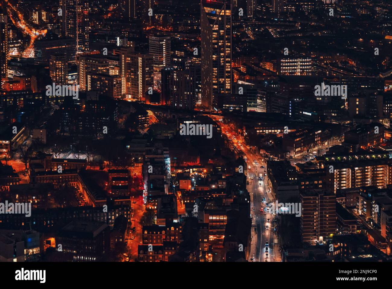 Night aerial view of south west London, orange yellow street lights ...