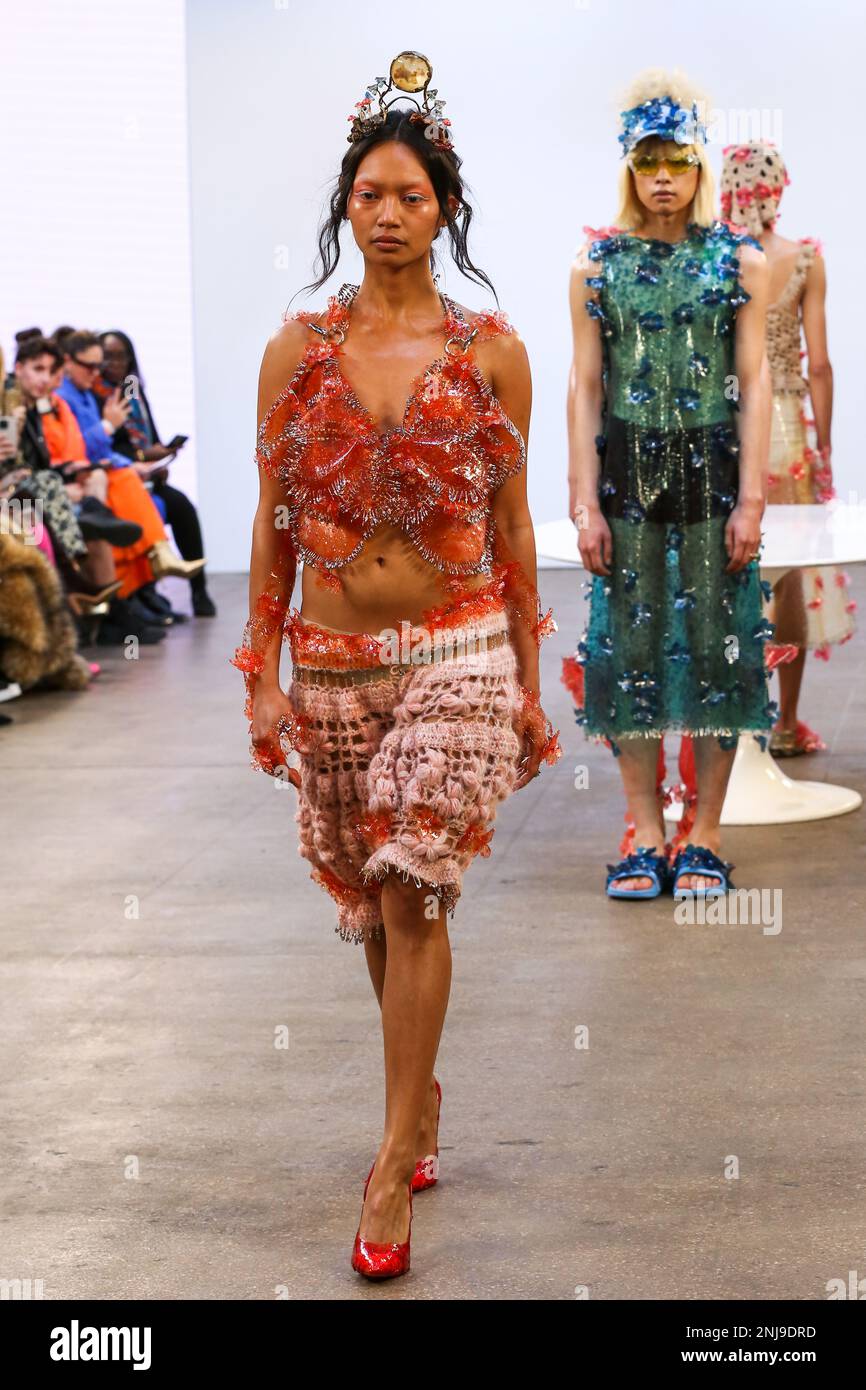 London, UK. 19th Feb, 2023. Models walk the runway wearing an outfit by ...