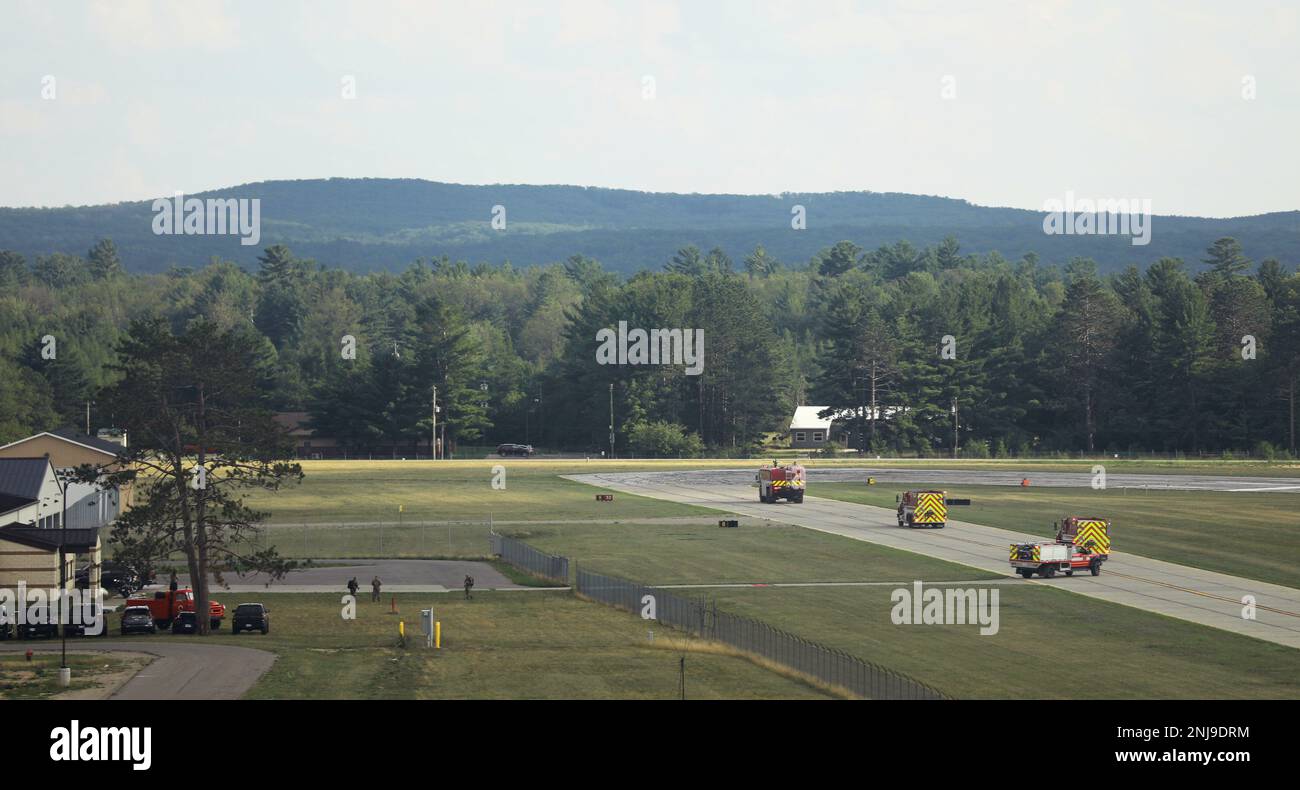 U.S. Army fire trucks with the Camp Grayling Fire Department, respond ...