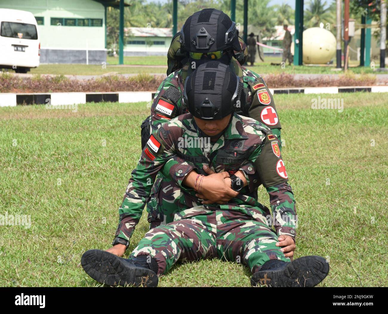 TNI soldiers perform buddy carry maneuvers during their medical ...