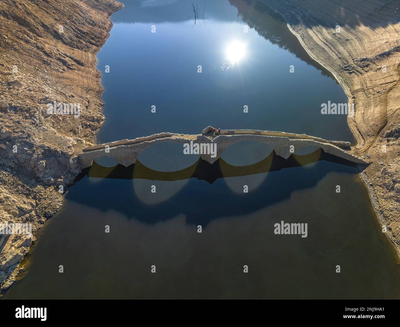 Aerial view of the medieval bridge of Querós, in the Susqueda reservoir ...
