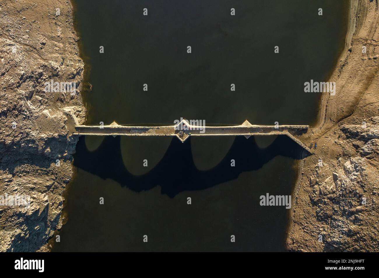 Aerial view of the medieval bridge of Querós, in the Susqueda reservoir ...
